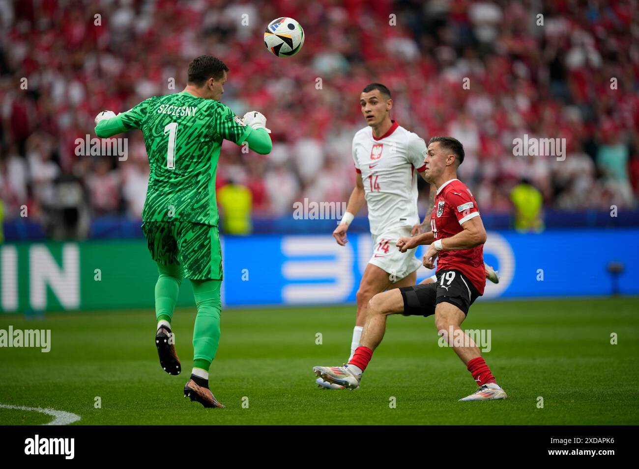 Poland's goalkeeper Wojciech Szczesny, left, heads the ball past Poland ...