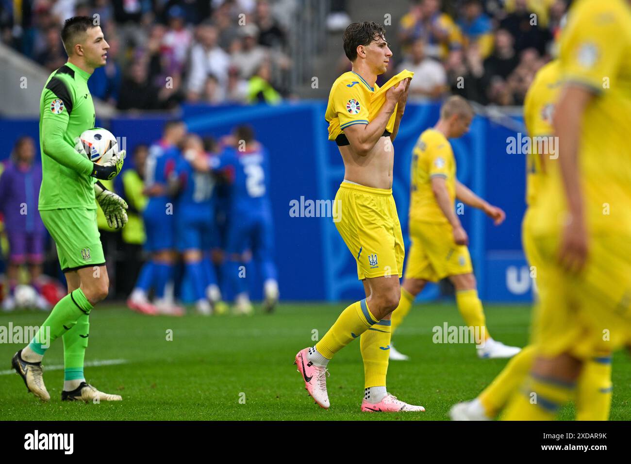 Anatoliy Trubin (12) of Ukraine and Illia Zabarnyi (13) of Ukraine ...