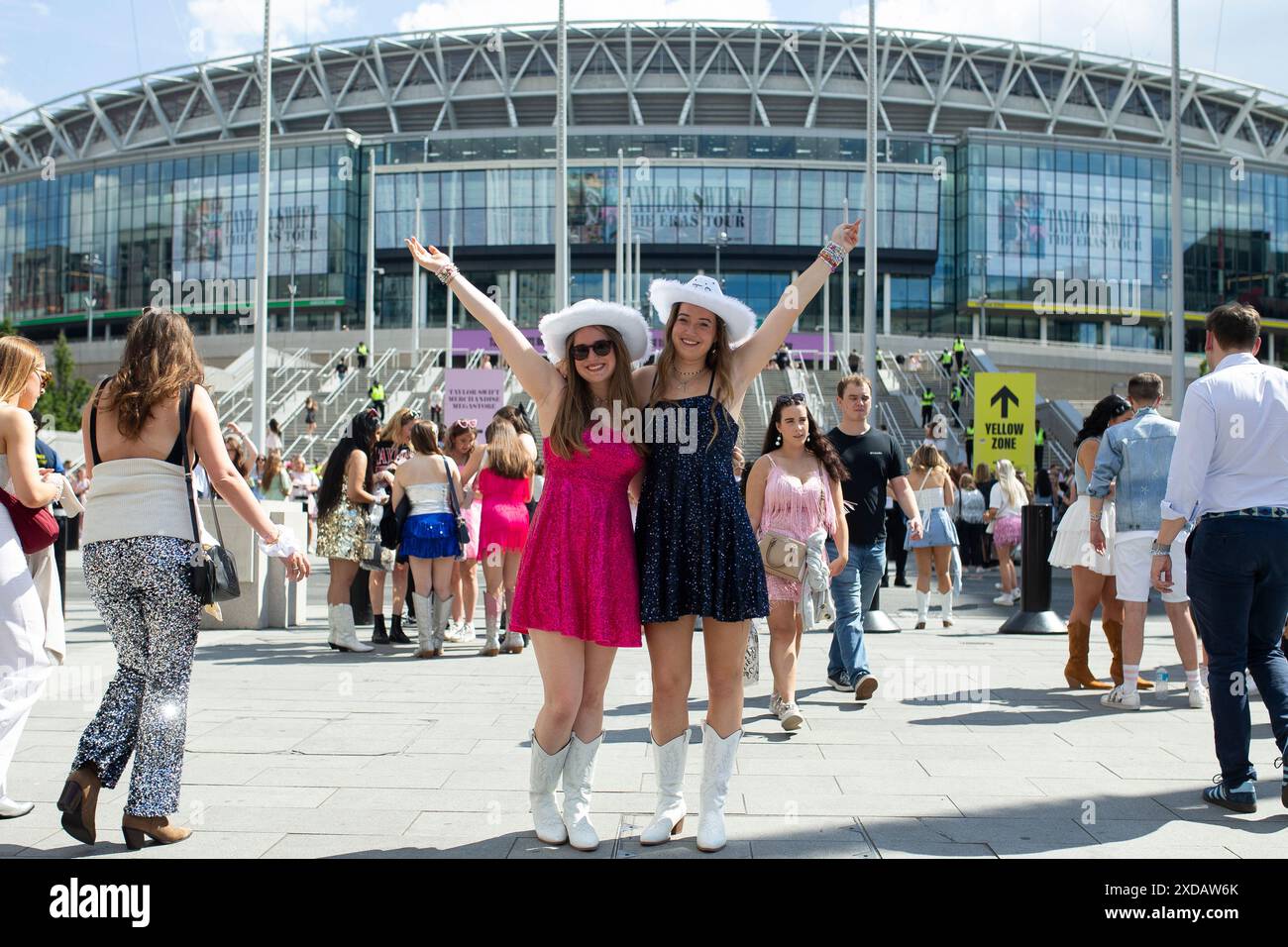 Fans pose for a photo outside Wembley Stadium in London, ahead of ...