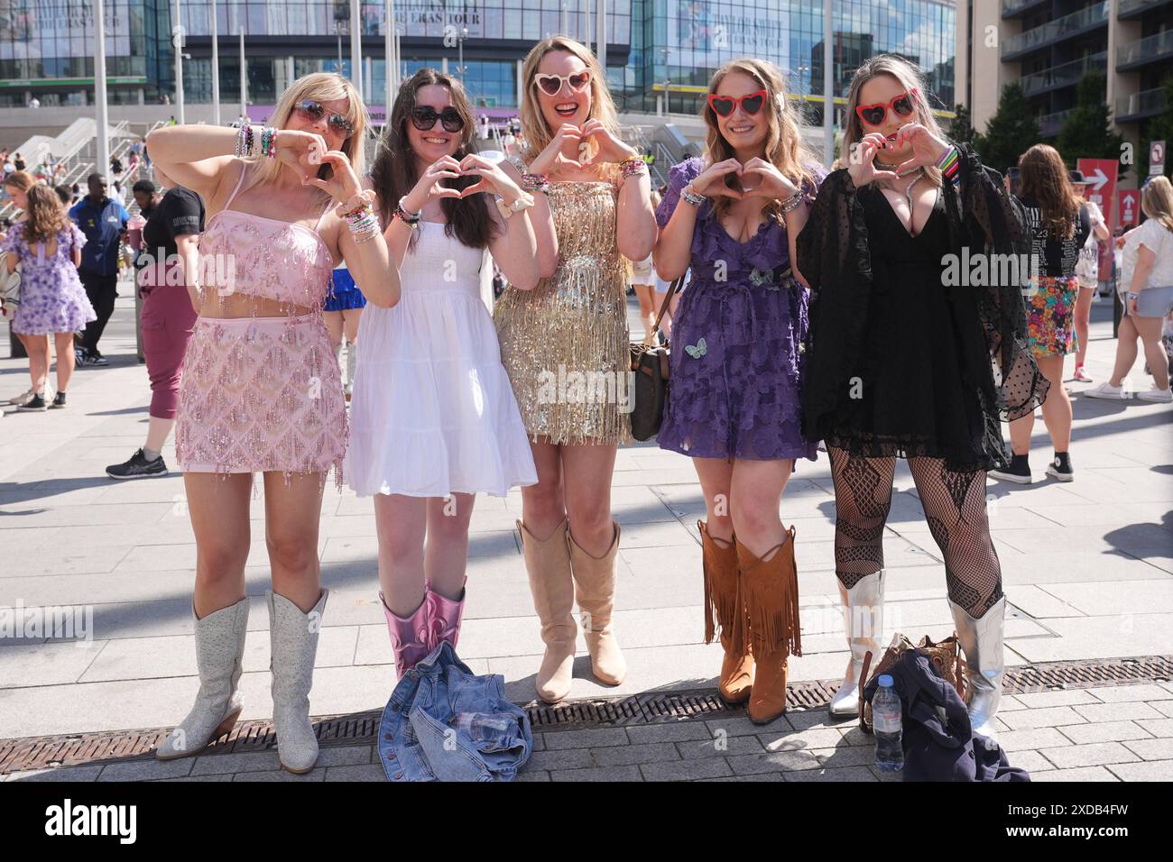 A group of fans pose for a photo outside Wembley Stadium in London ...