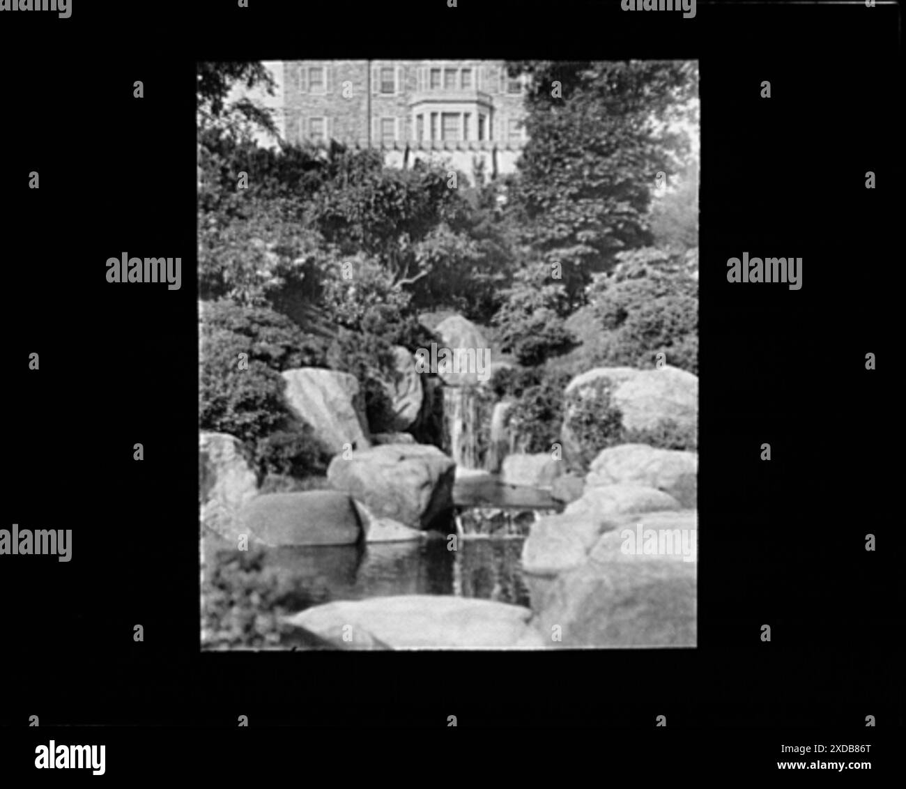 Garden and house at Kijkuit, John D. Rockefeller's estate, designed by ...