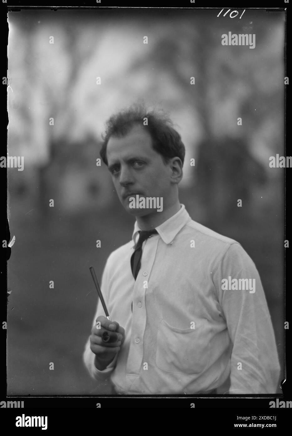 Kennerley, Mitchell, Mr., standing outdoors. Genthe photograph ...
