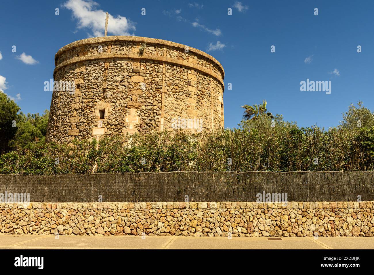 The historic Addaia Tower in Menorca, showcasing its rustic stone ...