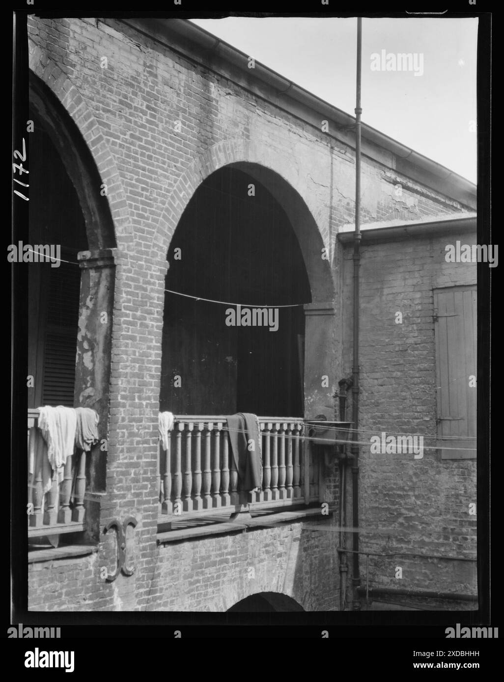 Arched balcony in a courtyard, New Orleans. Genthe photograph ...