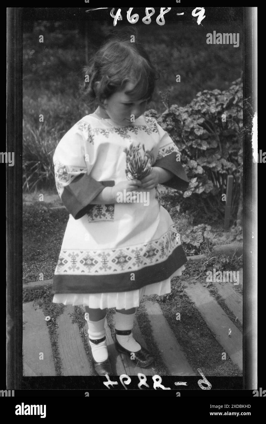 Unidentified child, standing outdoors. Genthe photograph collection ...
