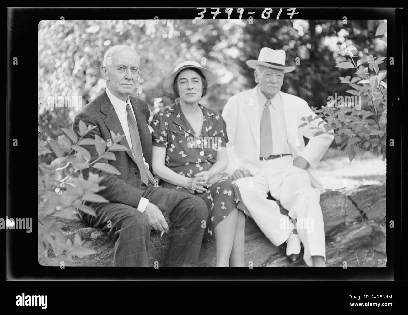 Timken, W.R., Mr. and Mrs., and John Hemming Fry, seated outdoors ...