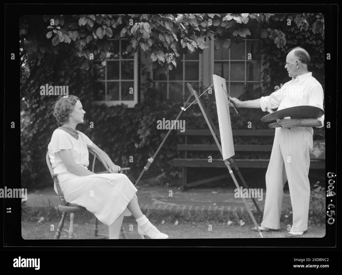King, Hamilton, Mr., painting Mrs. Hamilton's portrait outdoors. Genthe ...