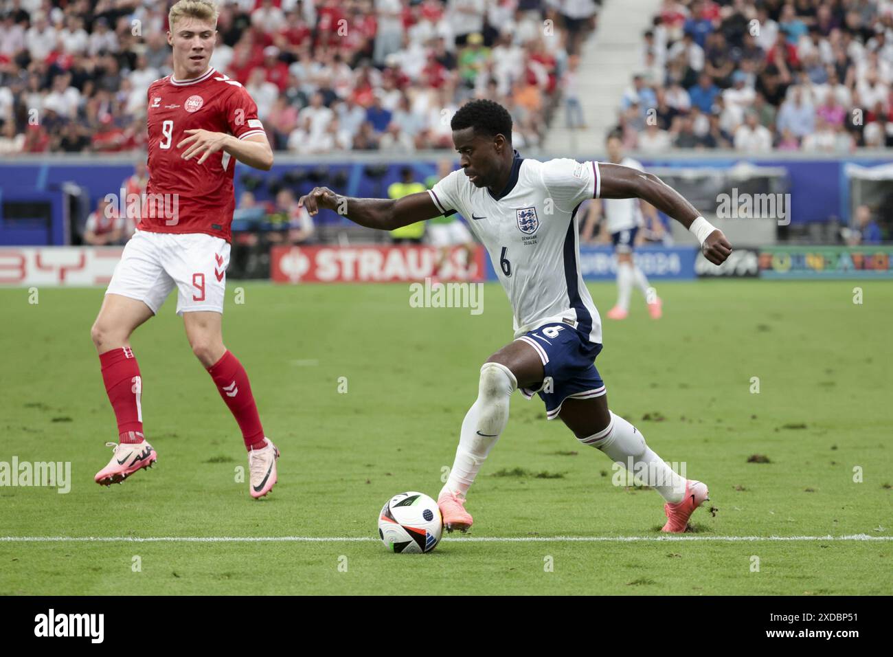 Marc Guehi of England, left Rasmus Hojlund of Denmark during the UEFA Euro 2024, Group C ...