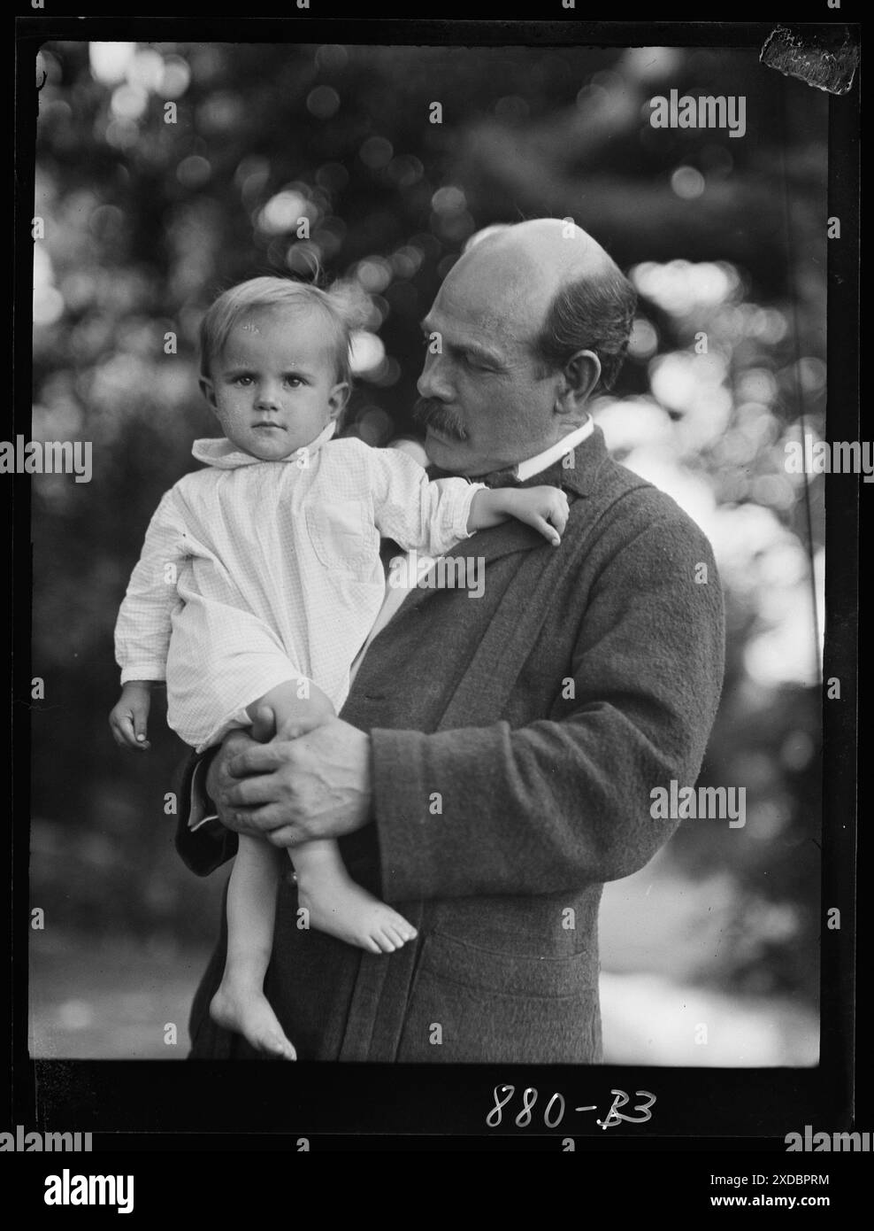 Borglum, Gutzon, Mr., and child, outdoors. Genthe photograph collection ...