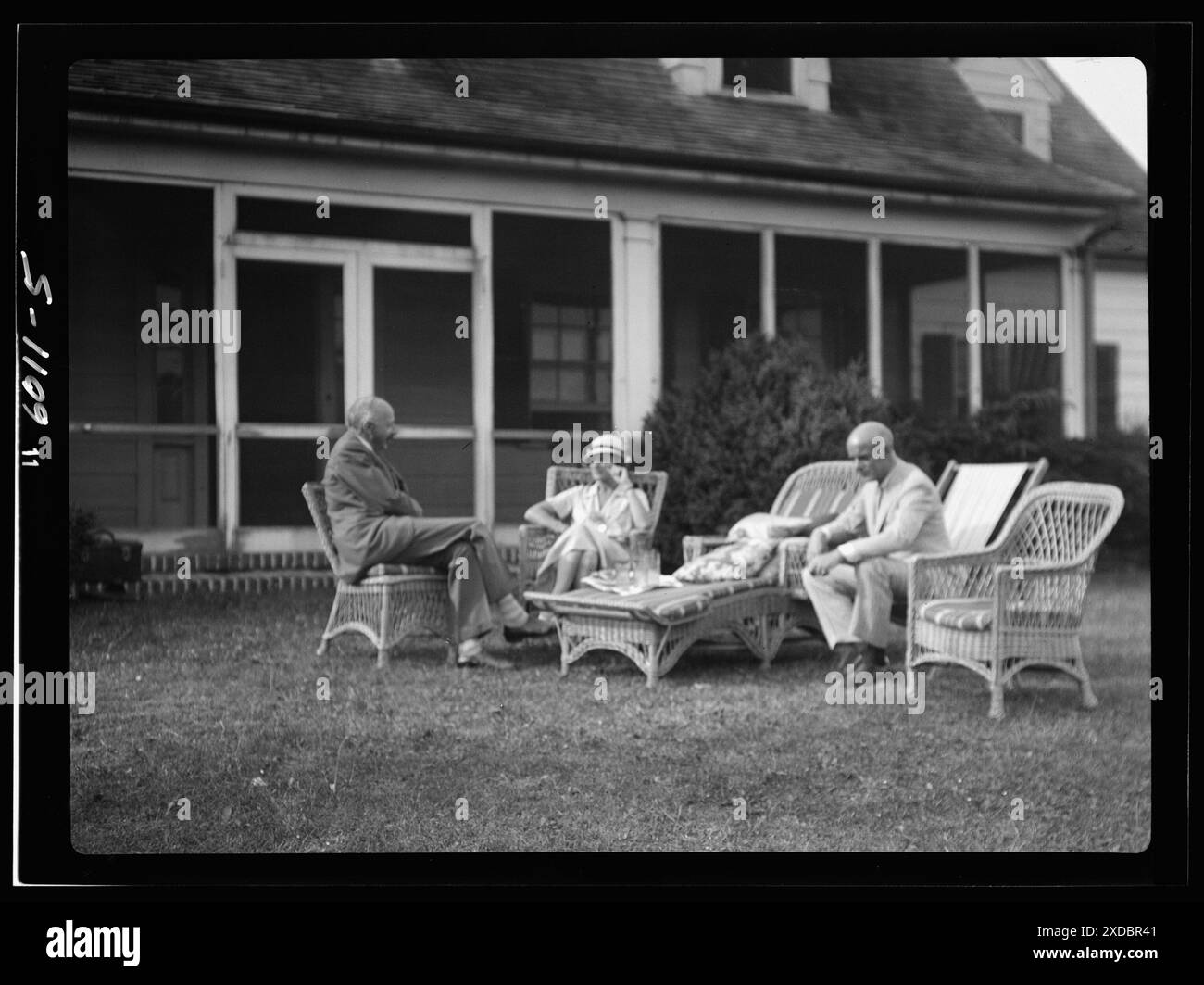 Sexton, Mr. and Mrs., and an unidentified man, seated outdoors. Genthe ...