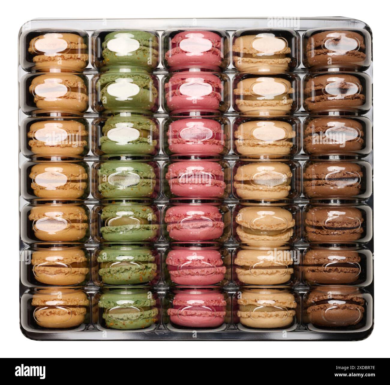 Assortment of macarons in a square plastic box with a transparent lid ...