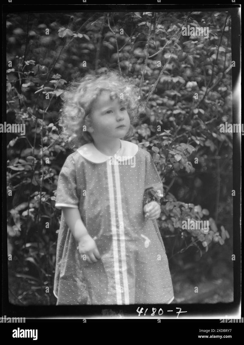 McCormick, Medill, child of, standing outdoors. Genthe photograph ...
