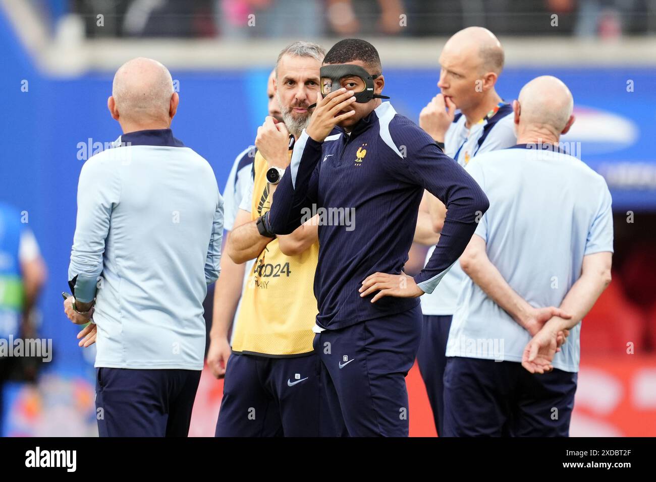 France's Kylian Mbappe (centre) with a protective mask on his face as ...