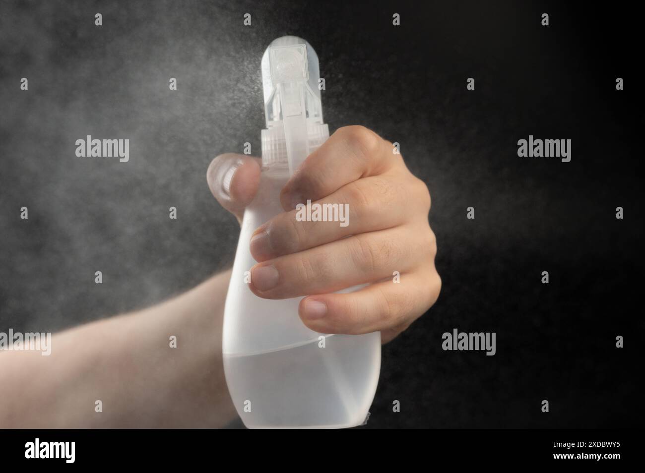 Plastic spray bottle front view in water cloud drops Stock Photo - Alamy