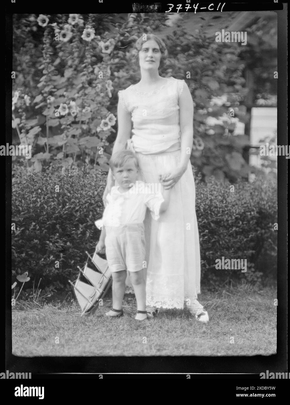 Conroy, Frank, Mrs., and child, standing outdoors. Genthe photograph ...