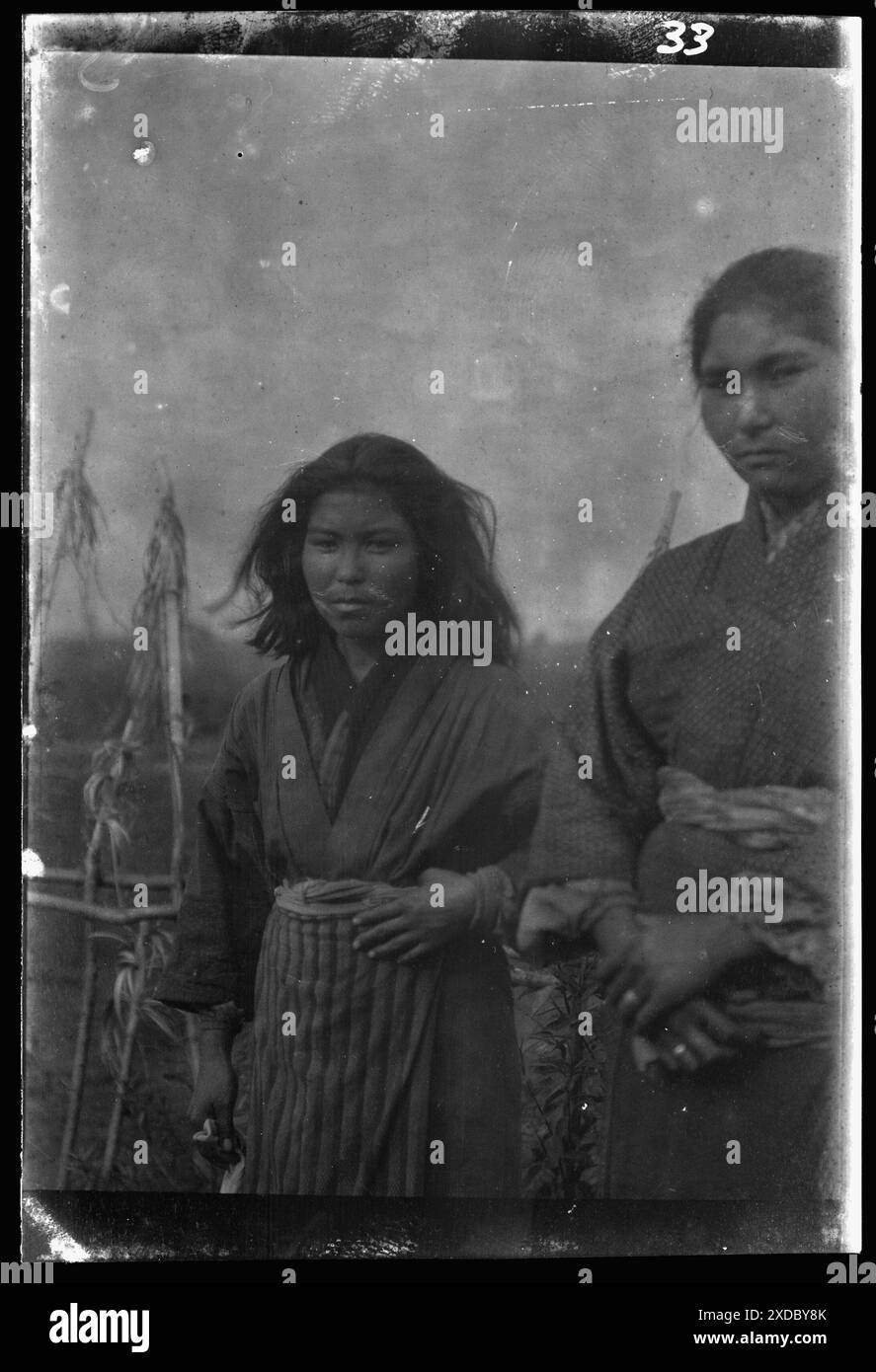 Two Ainu women standing outside. Genthe photograph collection Stock ...