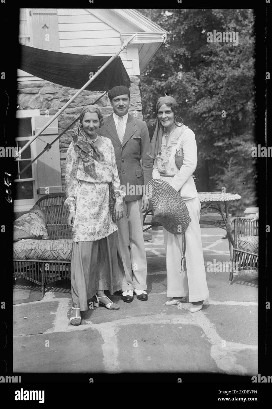 Beaumont, Pierre de, and two unidentified women, standing outdoors ...