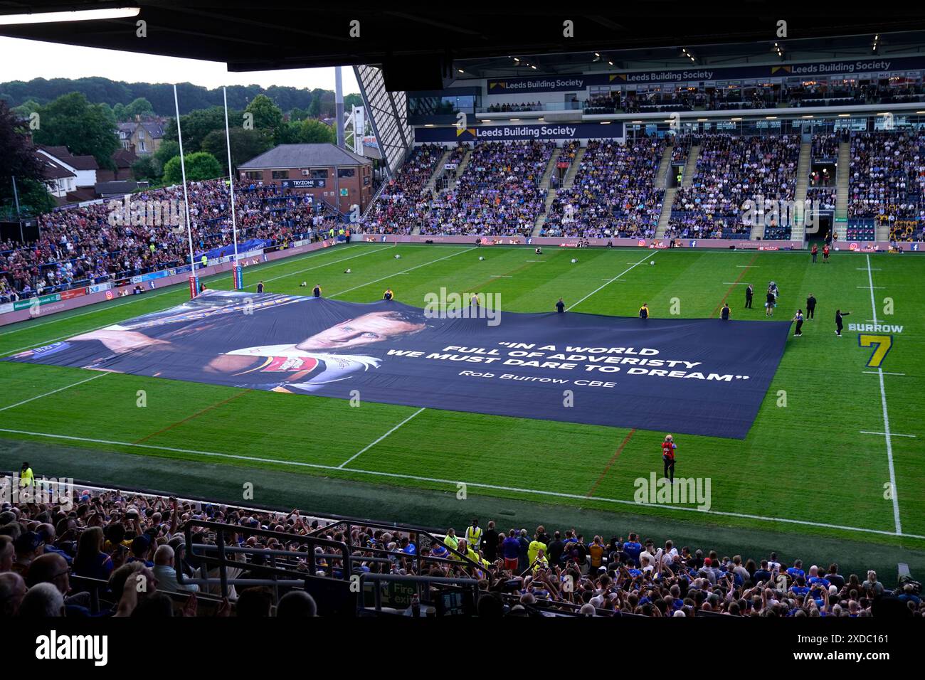 A general view of a large banner on the field in tribute to Rob Burrow ...