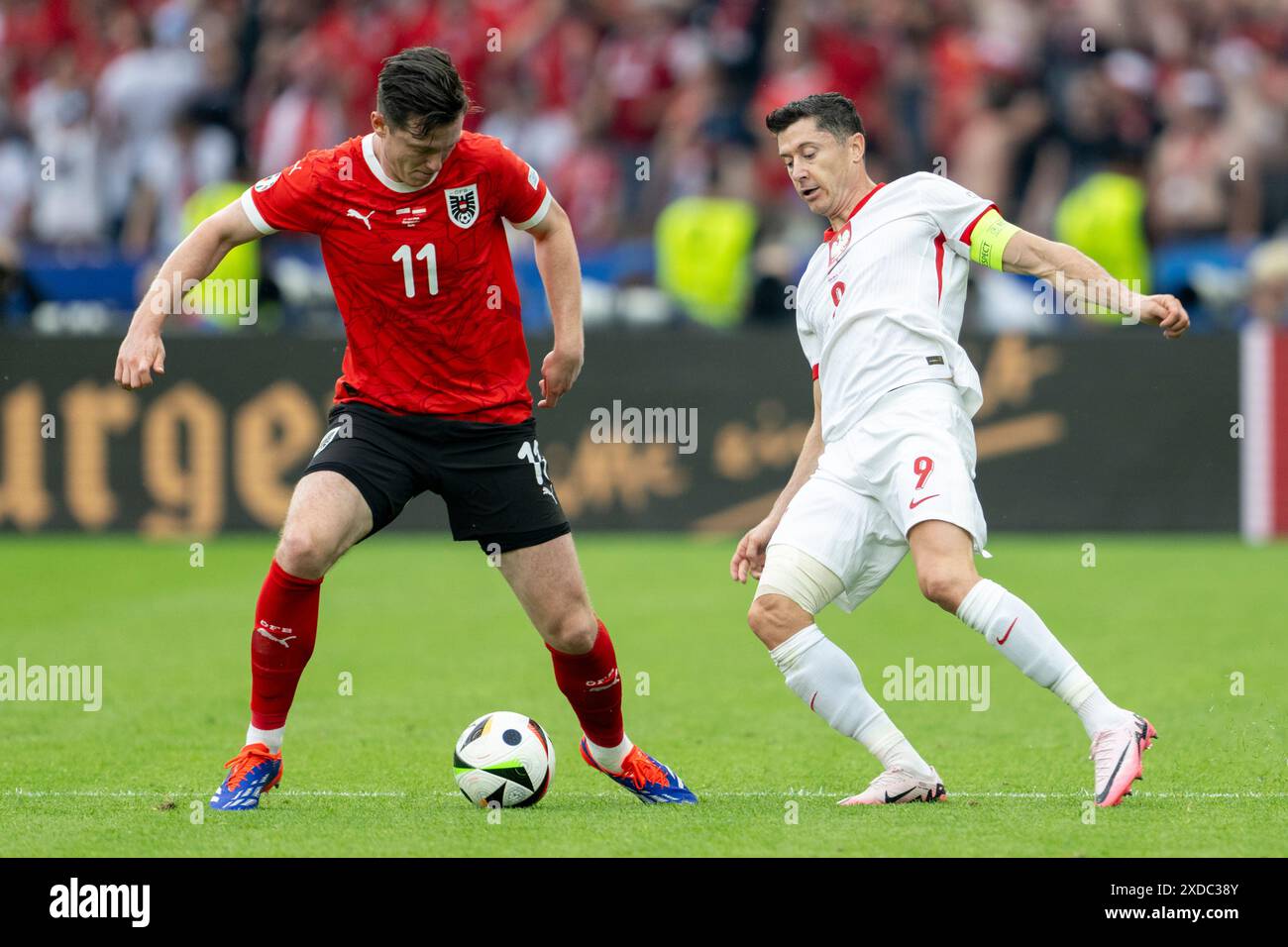 Michael Gregoritsch of Austria and Robert Lewandowski of Poland during ...