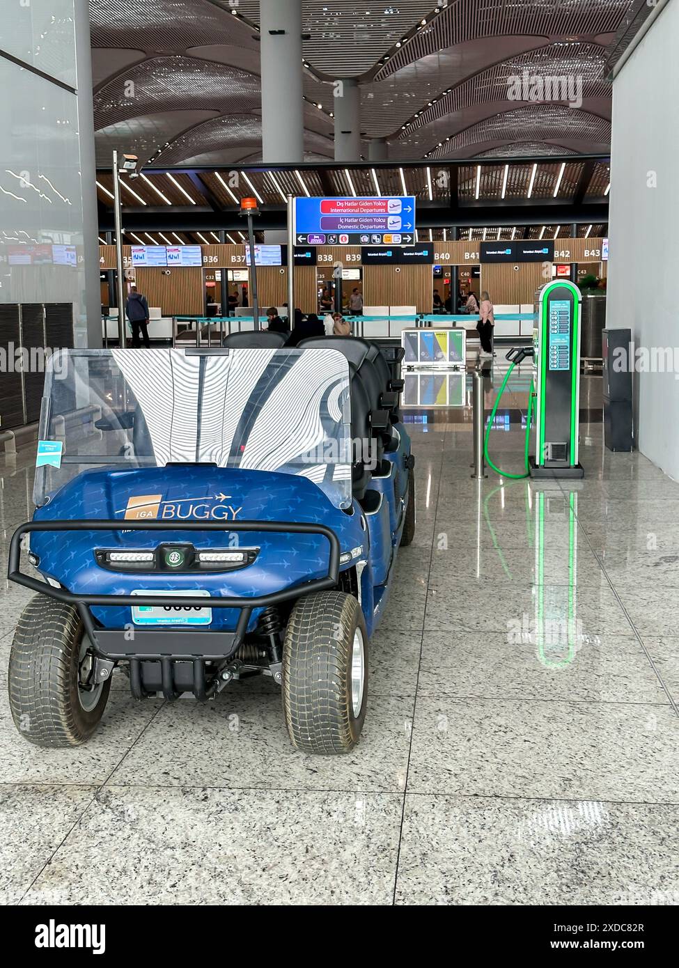 Istanbul, Turkey - April 19, 2024: Electric golf cart and charging ...