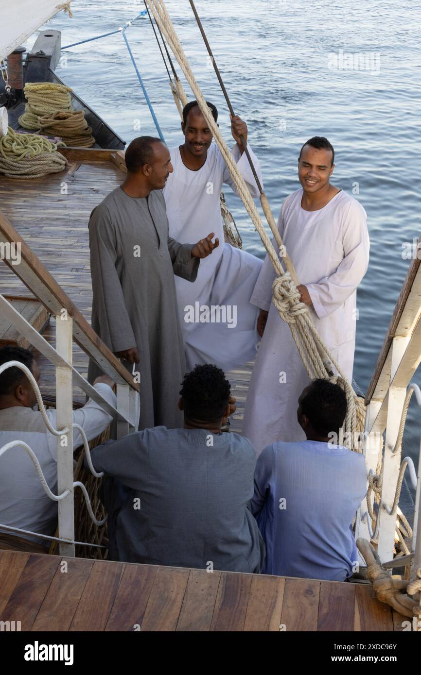Six traditionally dressed Egyptian crew members of a Lazuli dahabiya ...