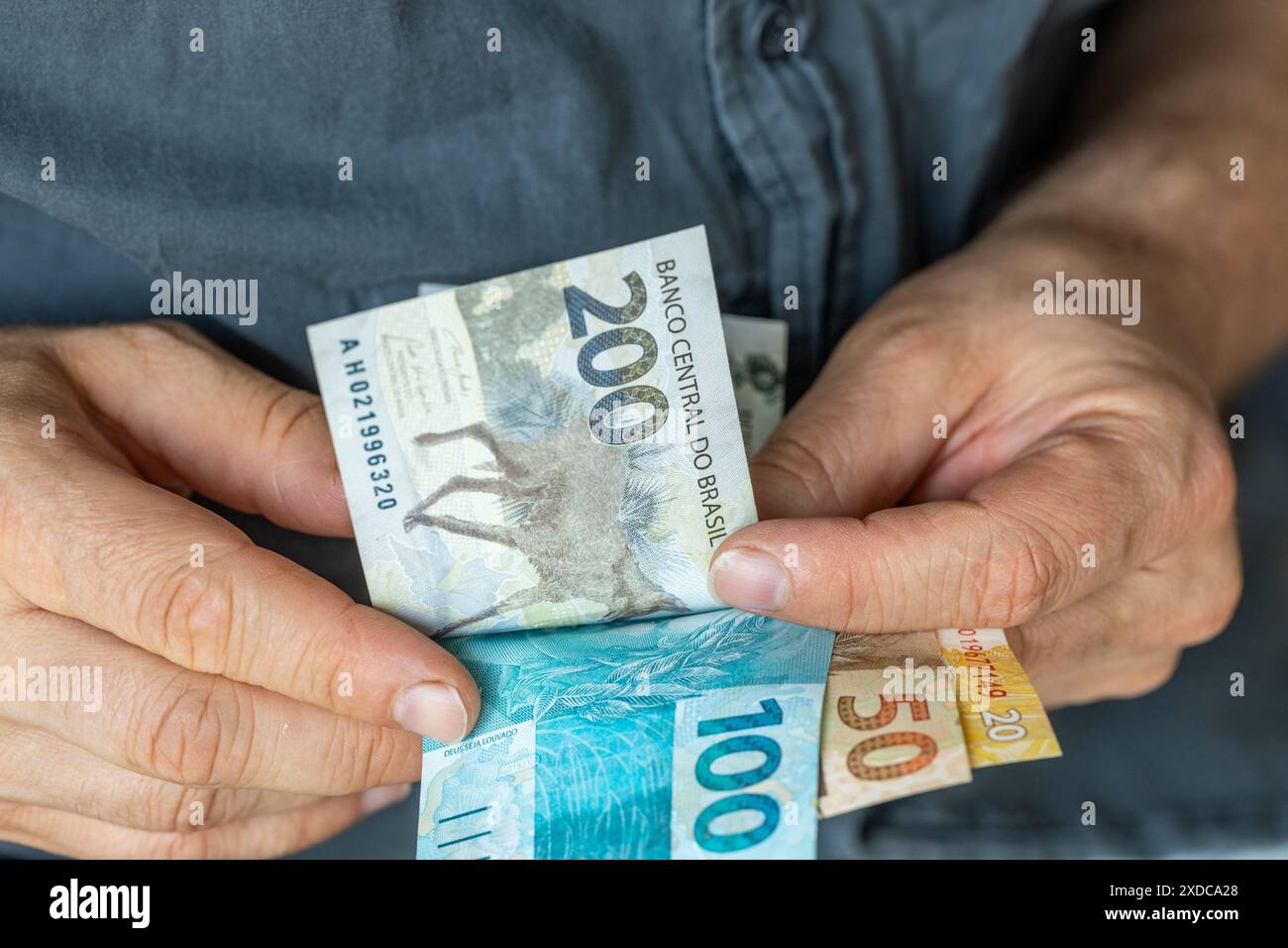 Brazilian man counting money, financial concept, Brazil finance Stock ...