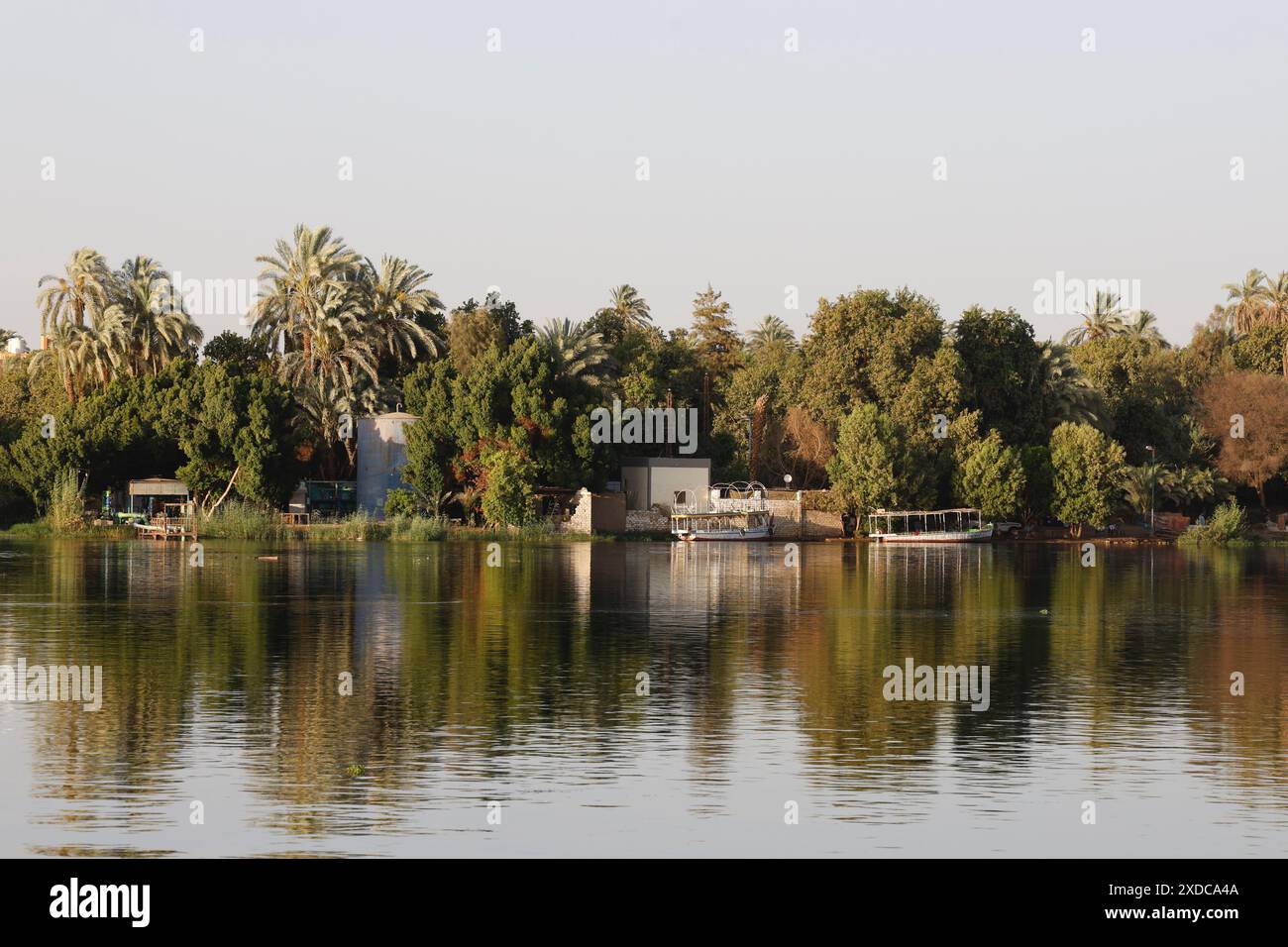 A village water-treatment installation and two river ferries are ...