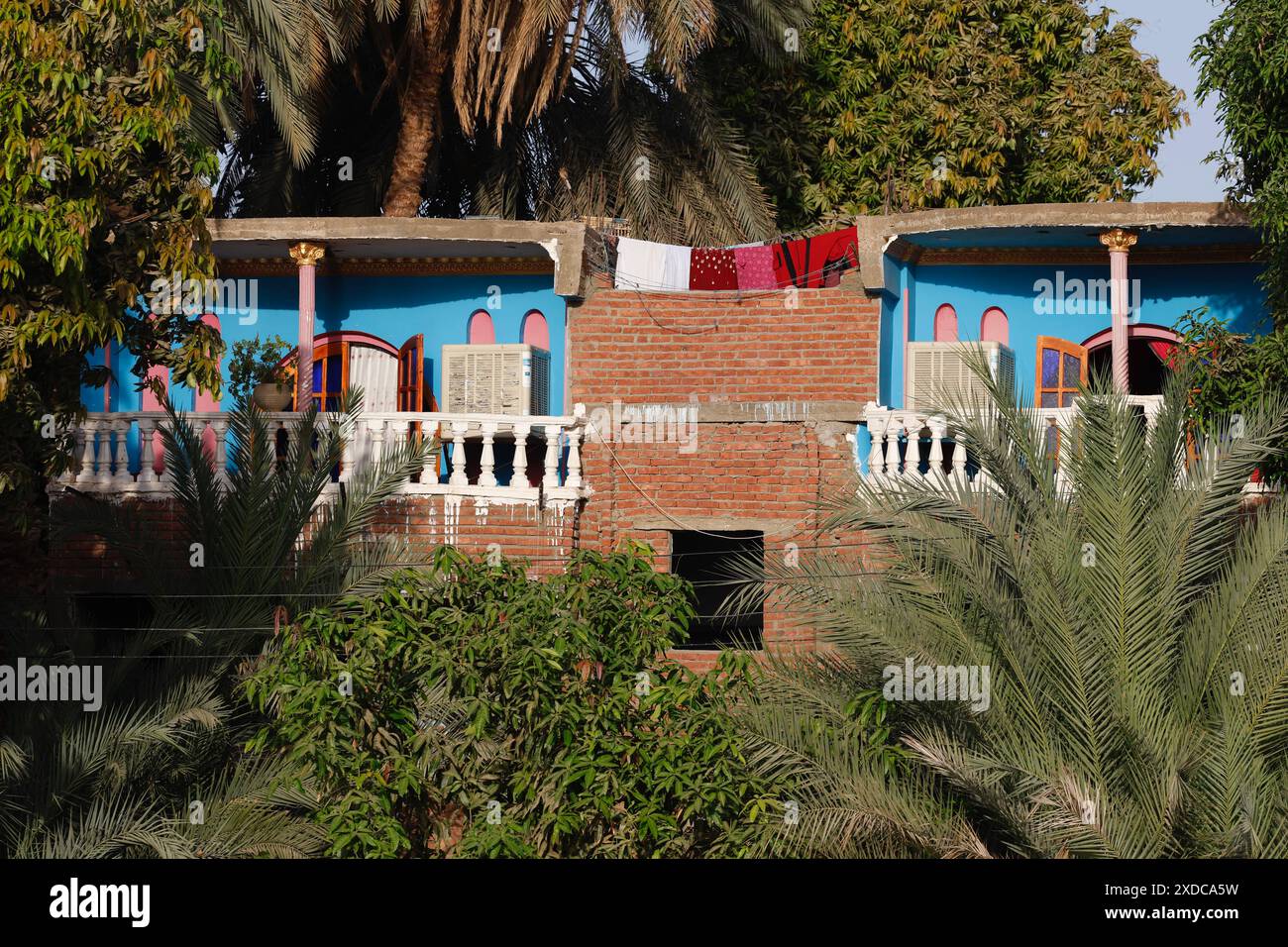 The owner of this middle-class house on the river Nile south of Esna ...