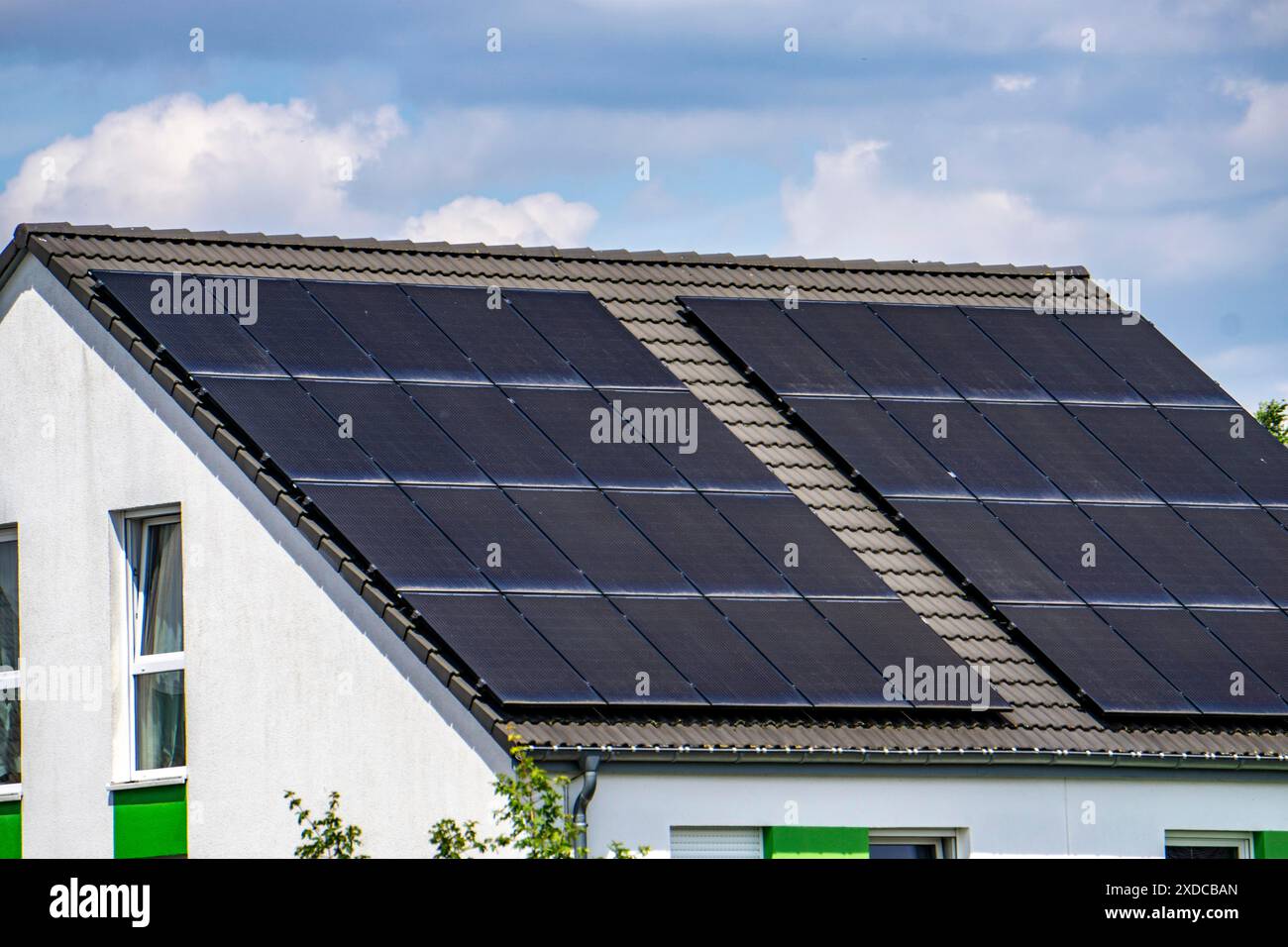 Solar roof, solar panels on a pitched roof of a residential building ...