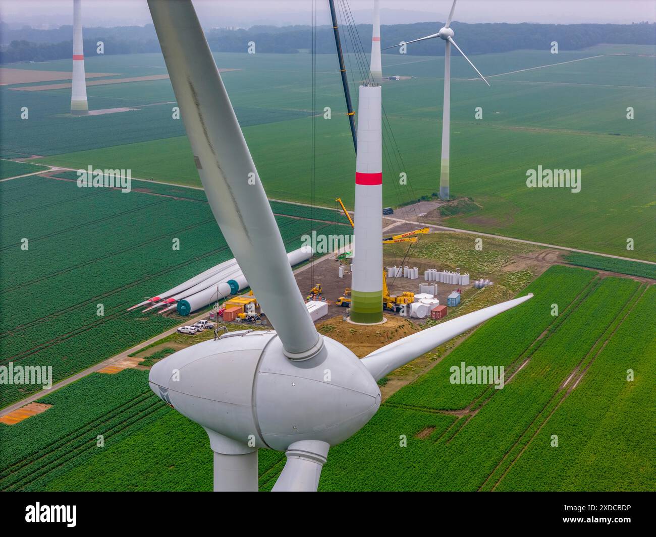 Construction of the tower of a wind power plant in a wind farm near ...
