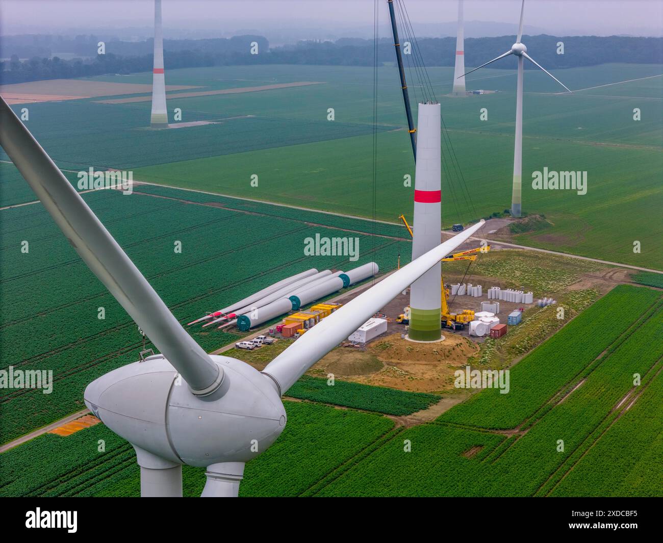Construction of the tower of a wind power plant in a wind farm near ...