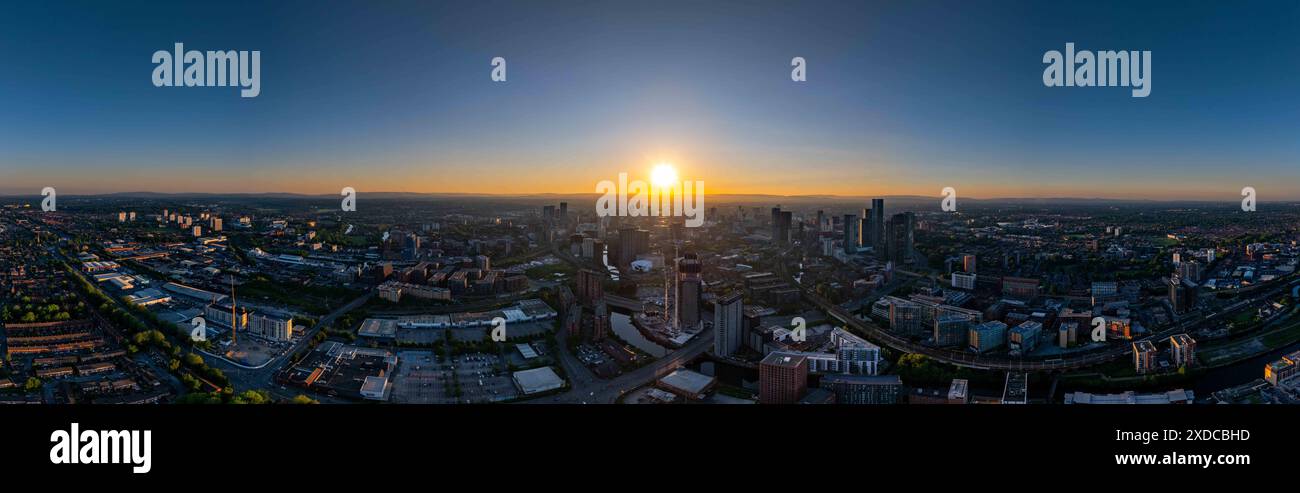 This image captures a panoramic sunset view featuring landmarks around ...