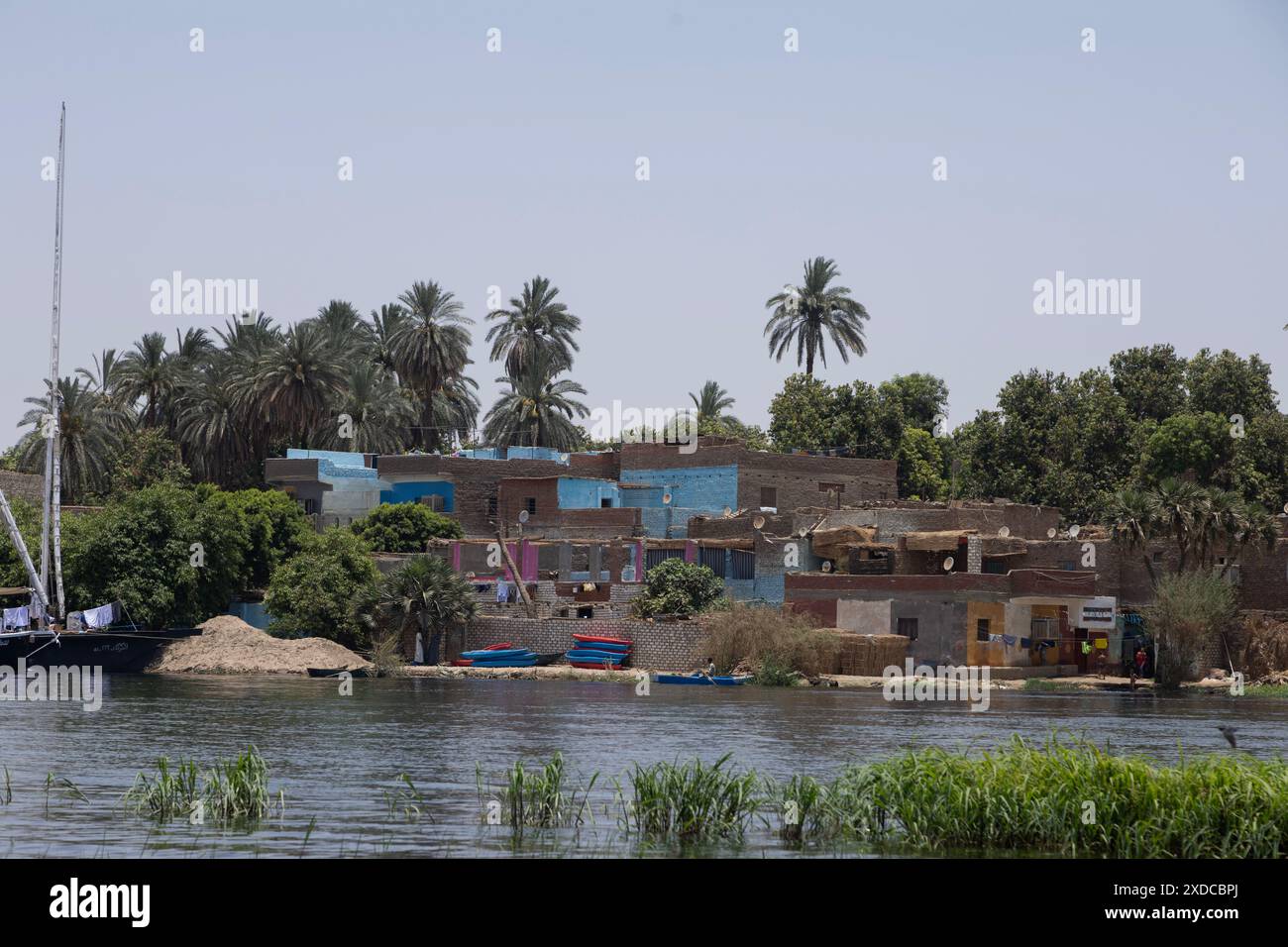 Bisaw, a colourful and busy Egyptian village with mudbrick houses on an island in the river Nile ...