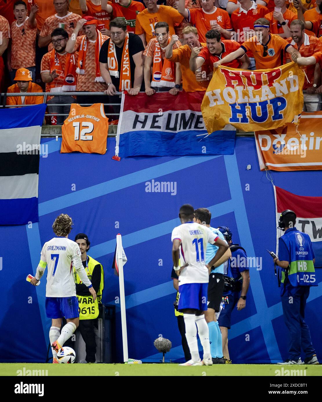 LEIPZIG - Antoine Griezmann of France (l) receives cups of beer from Dutch fans during the UEFA ...