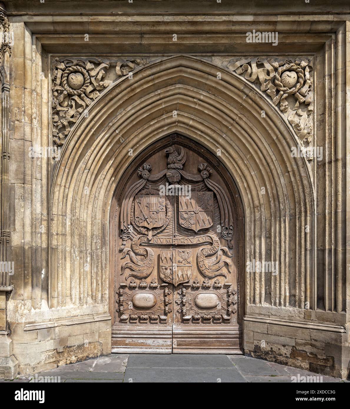 Ornately carved wooden doors at the west entrance to Bath Abbey, Bath ...