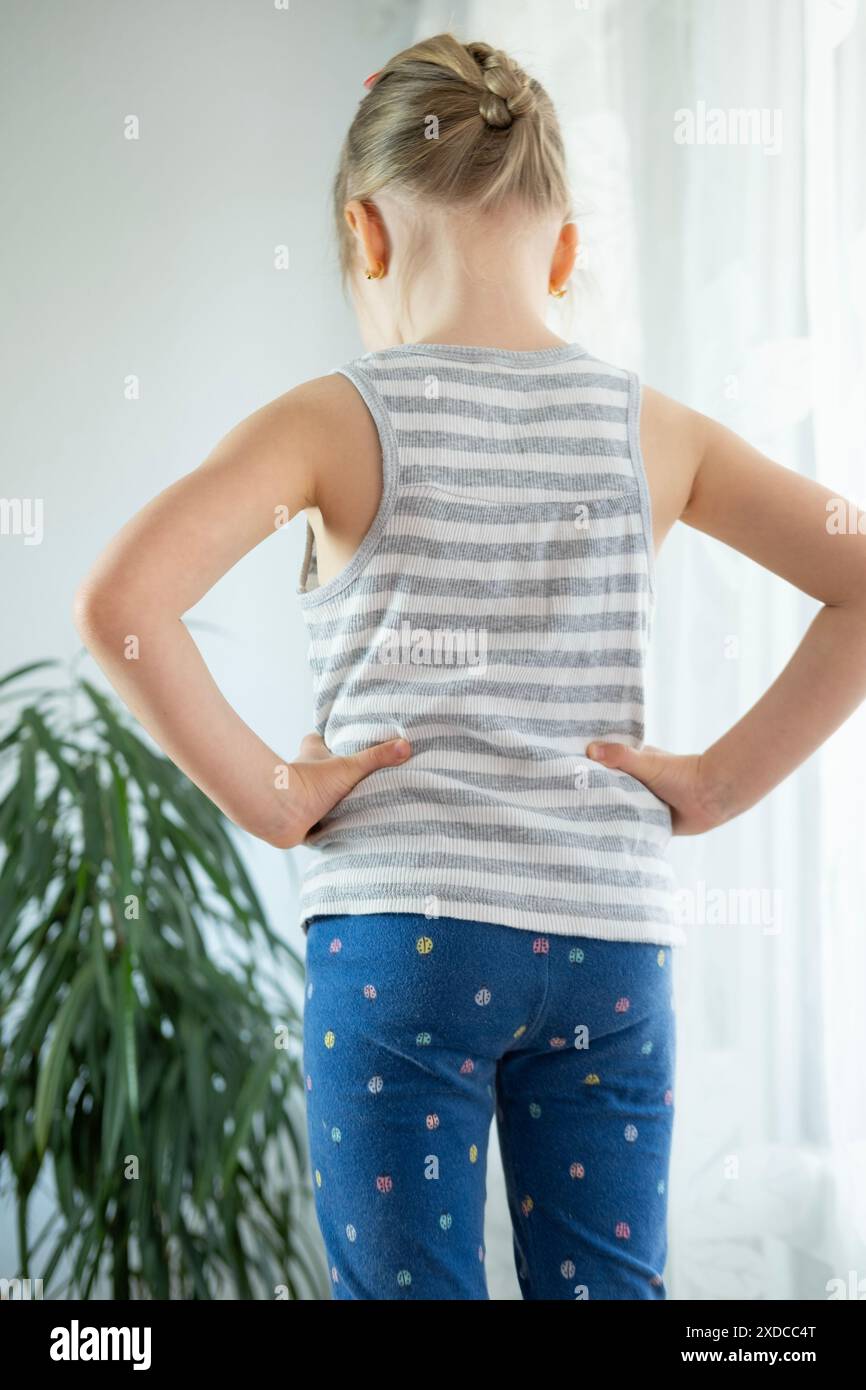 five-year-old child, young girl stands with back straight, showcasing ...