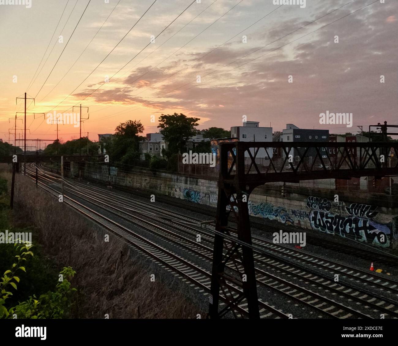 The sun rises along the Northeast Corridor rail line running through ...