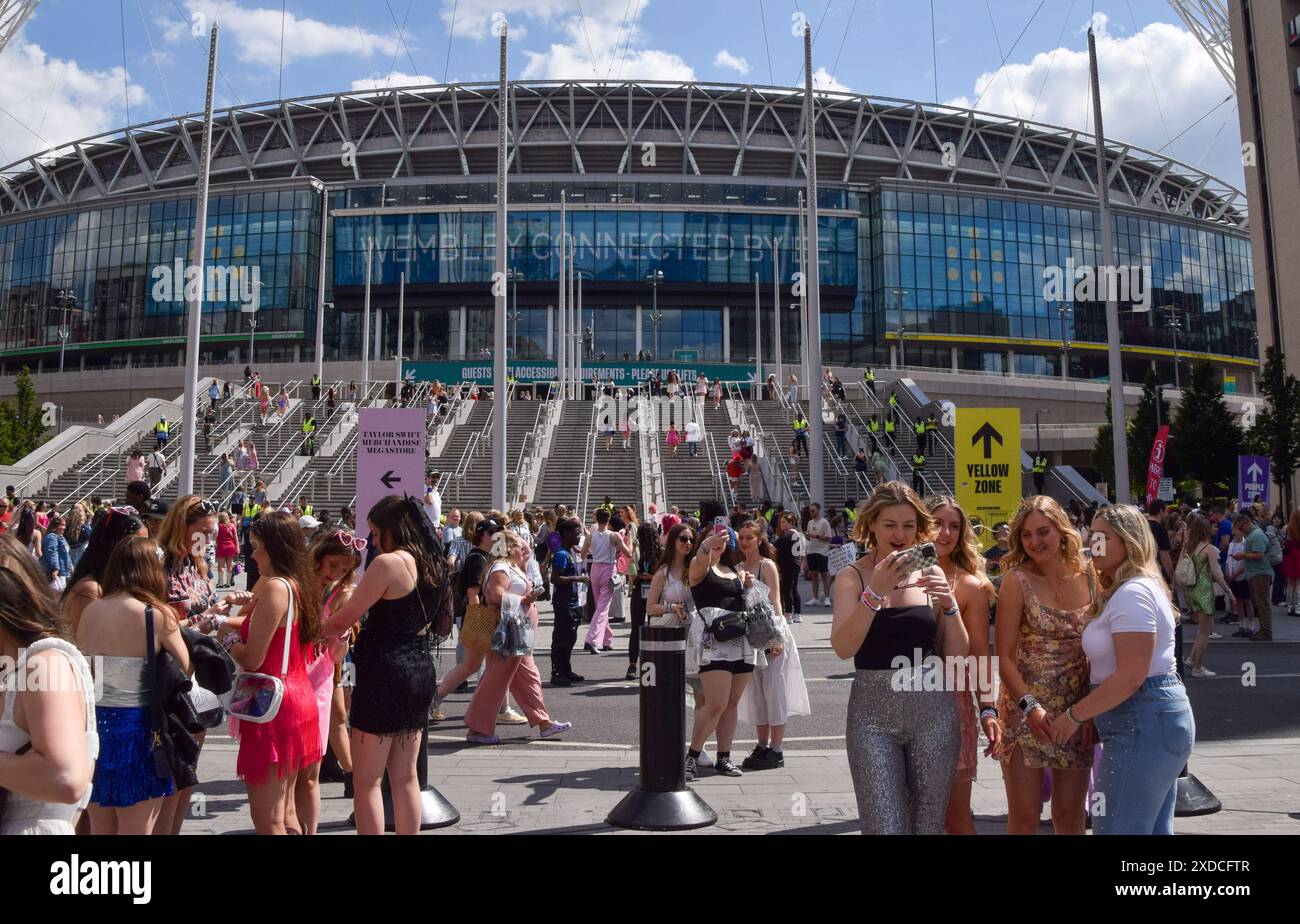 London, UK. 21st June 2024. Swifties arrive at Wembley Stadium as ...