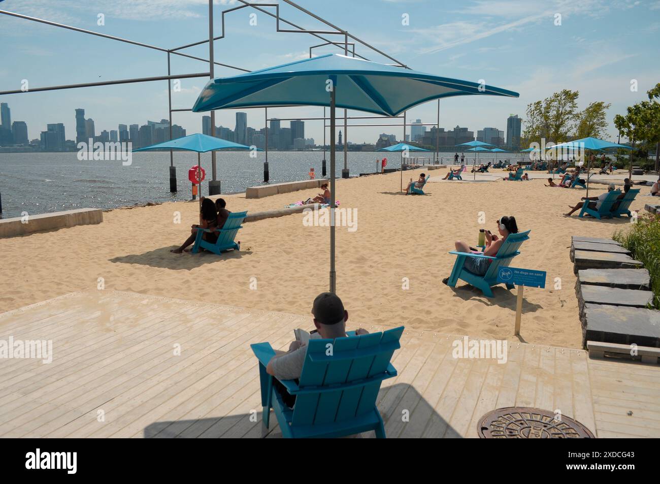 New York, USA. 20th June, 2024. Pedestrians are seen at a beach in ...