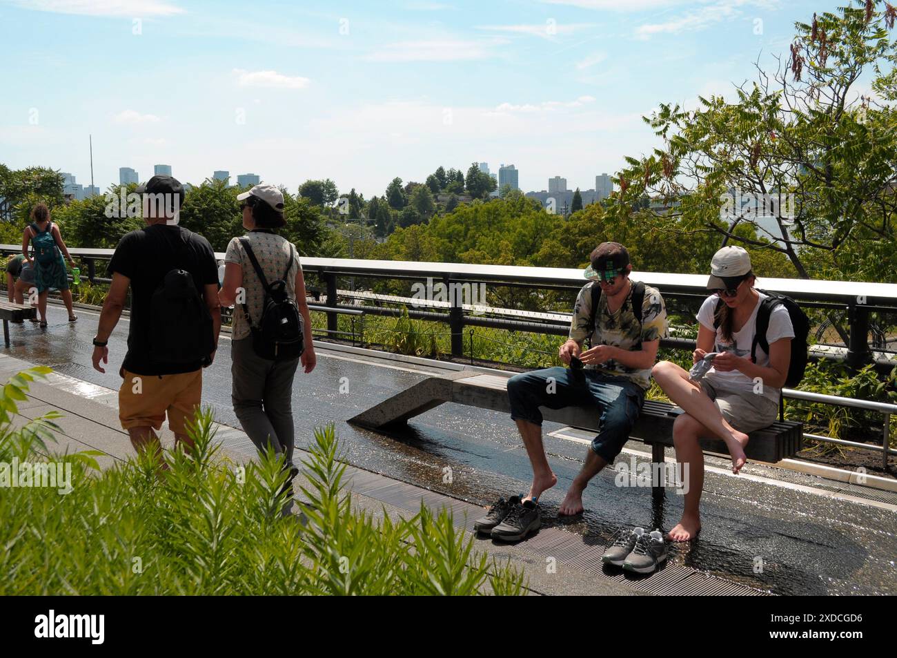 New York, United States. 20th June, 2024. Pedestrians place their feet ...