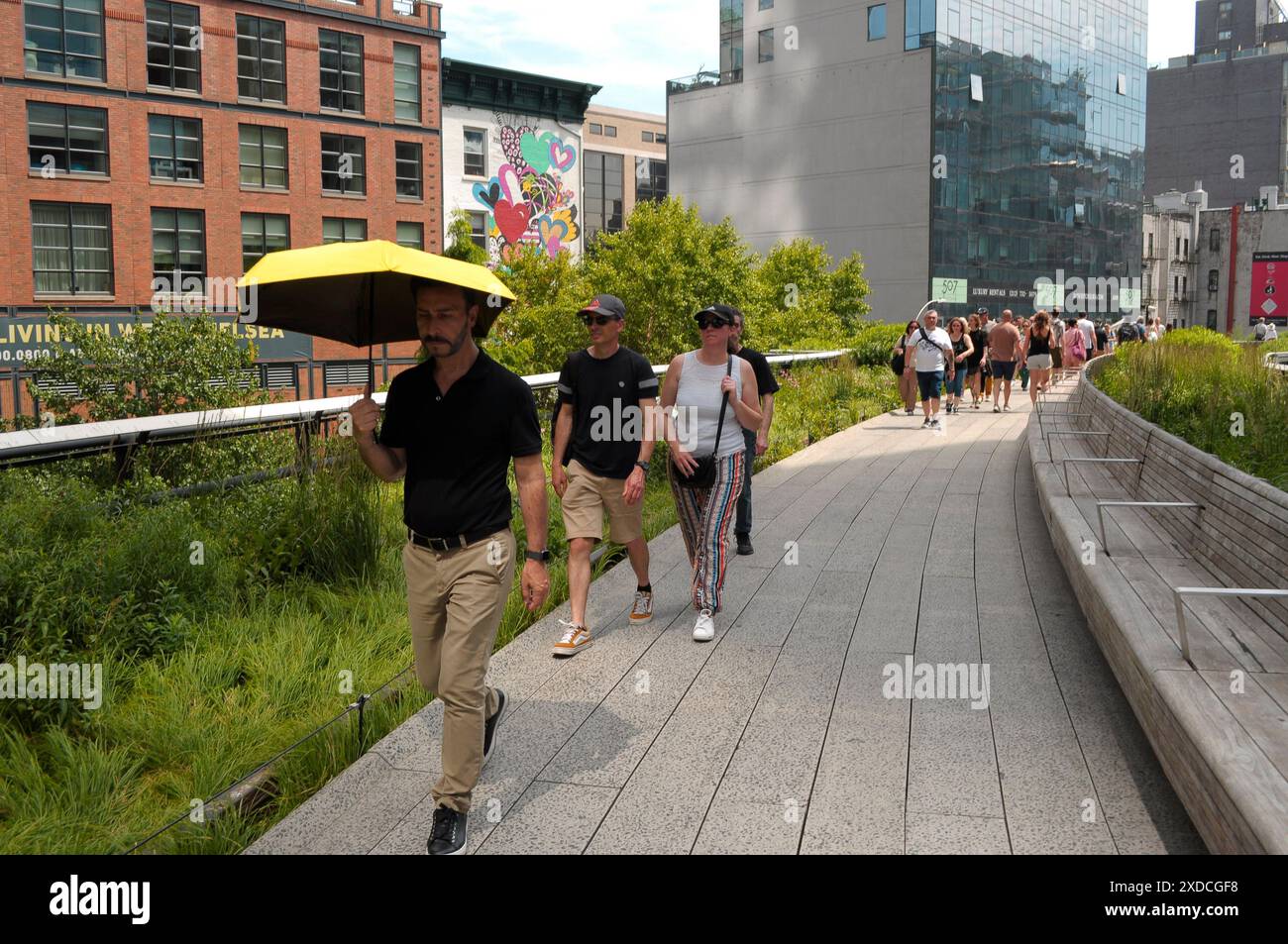 New York, United States. 20th June, 2024. Pedestrians walk in hot ...
