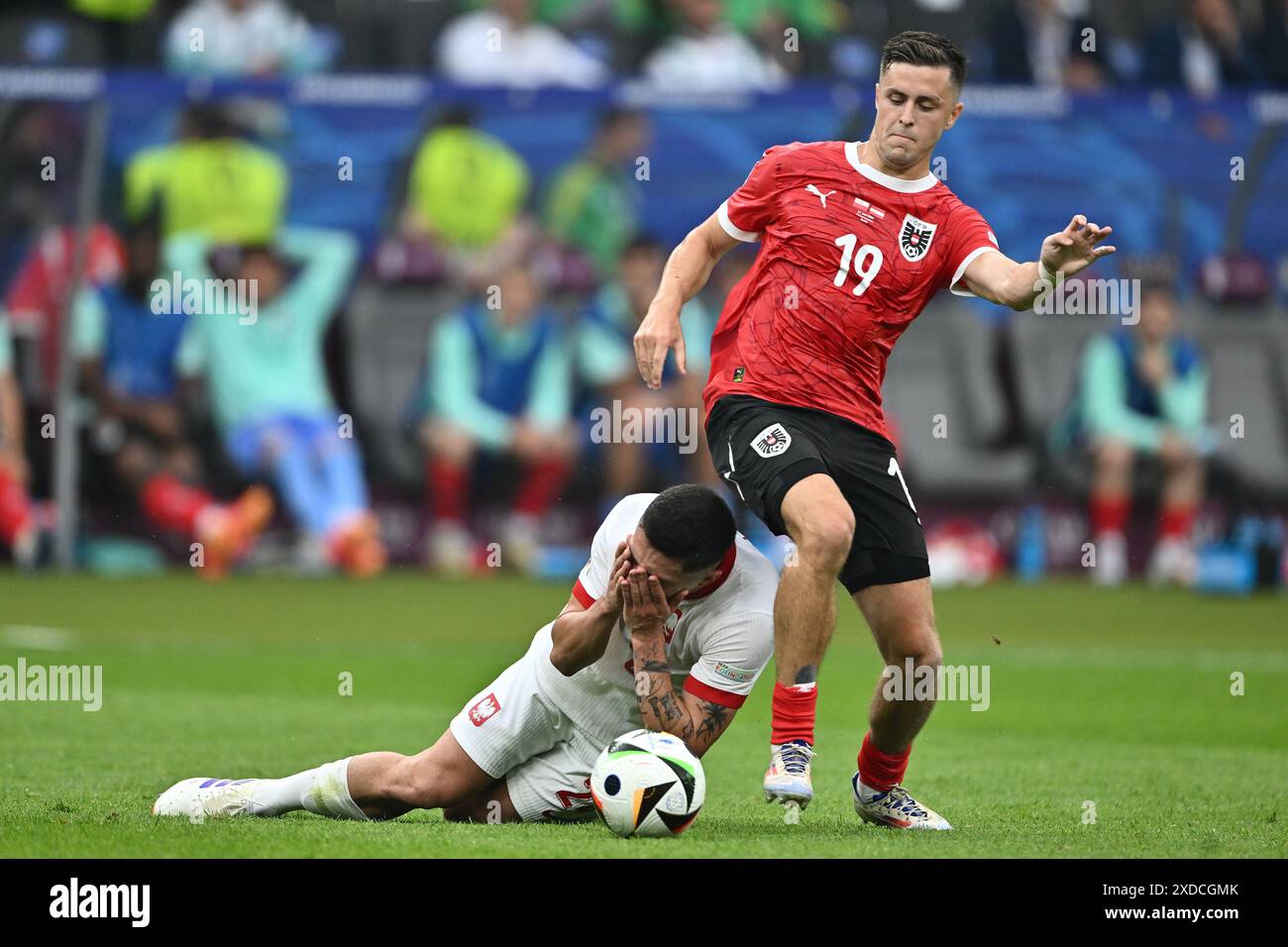 BERLIN, GERMANY - JUNE 21: Bartosz Slisz of Poland and Christoph ...