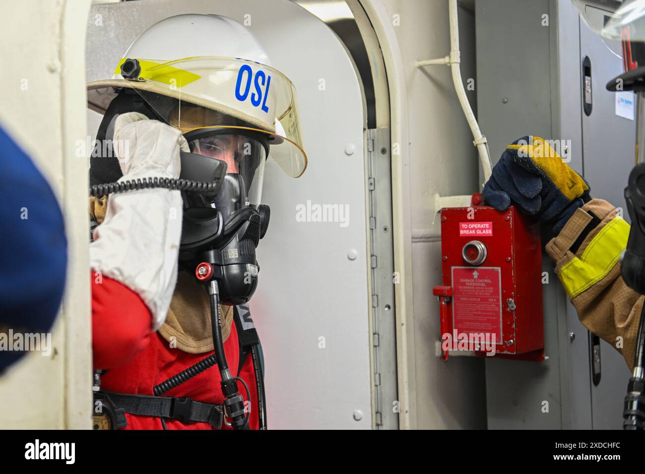 U.S. Petty Officer 3rd Class Raymond Fitzgerald reports back to the ...
