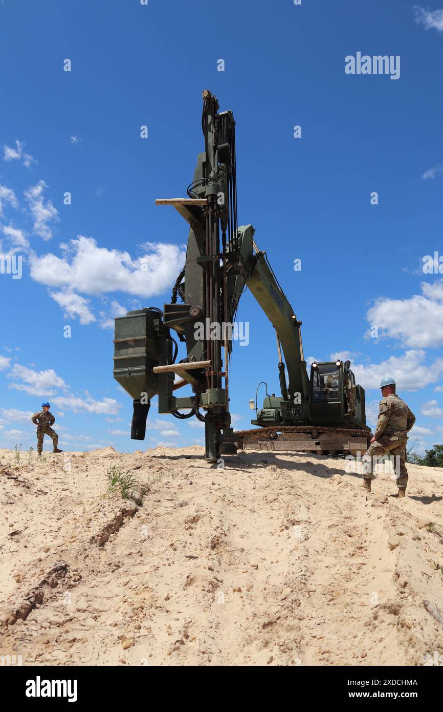 Soldiers with the 106th Engineer Detachment (Quarry) work on a project ...