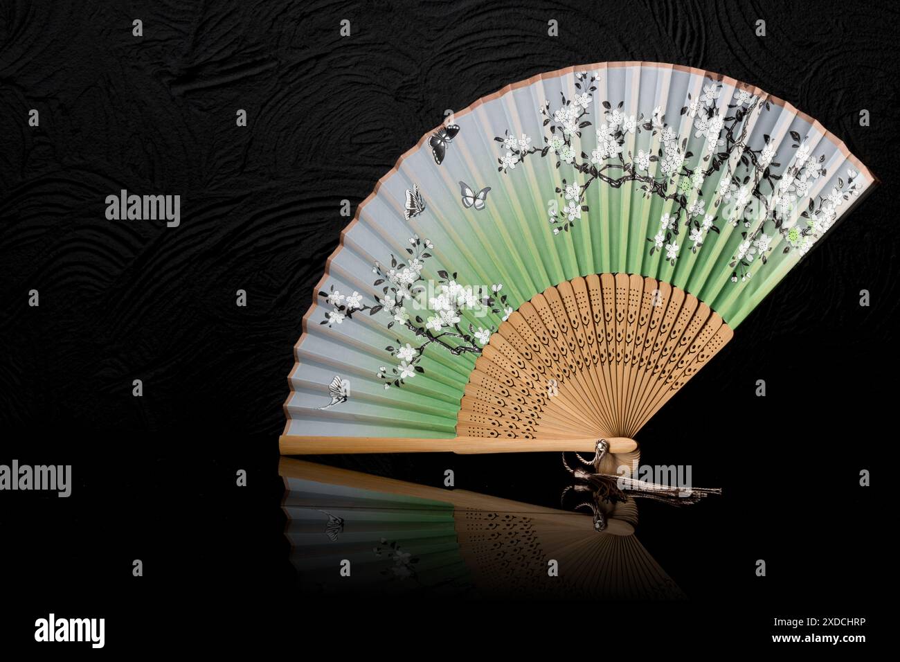Decorative Oriental Fan with Floral Design Stock Photo - Alamy