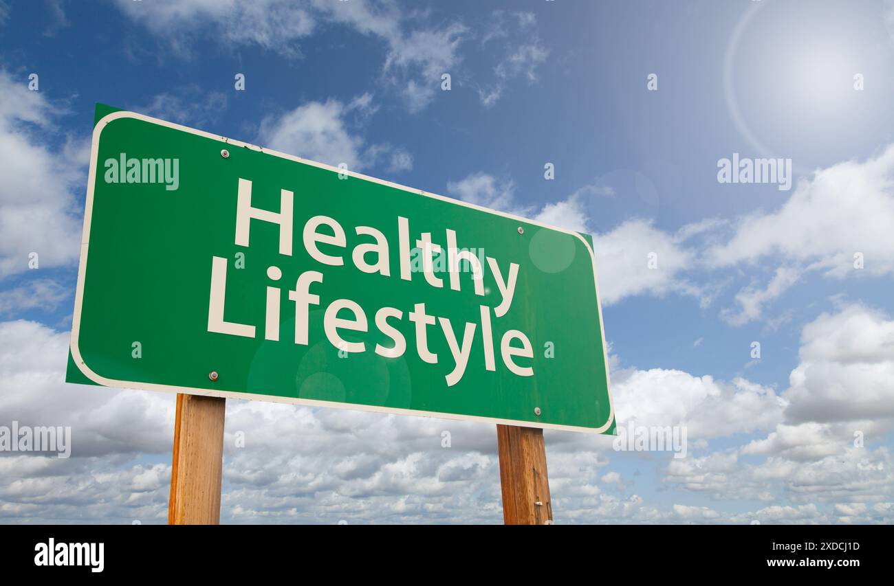 Healthy Lifestyle Green Road Sign Over Clouds and Blue Sky Stock Photo ...