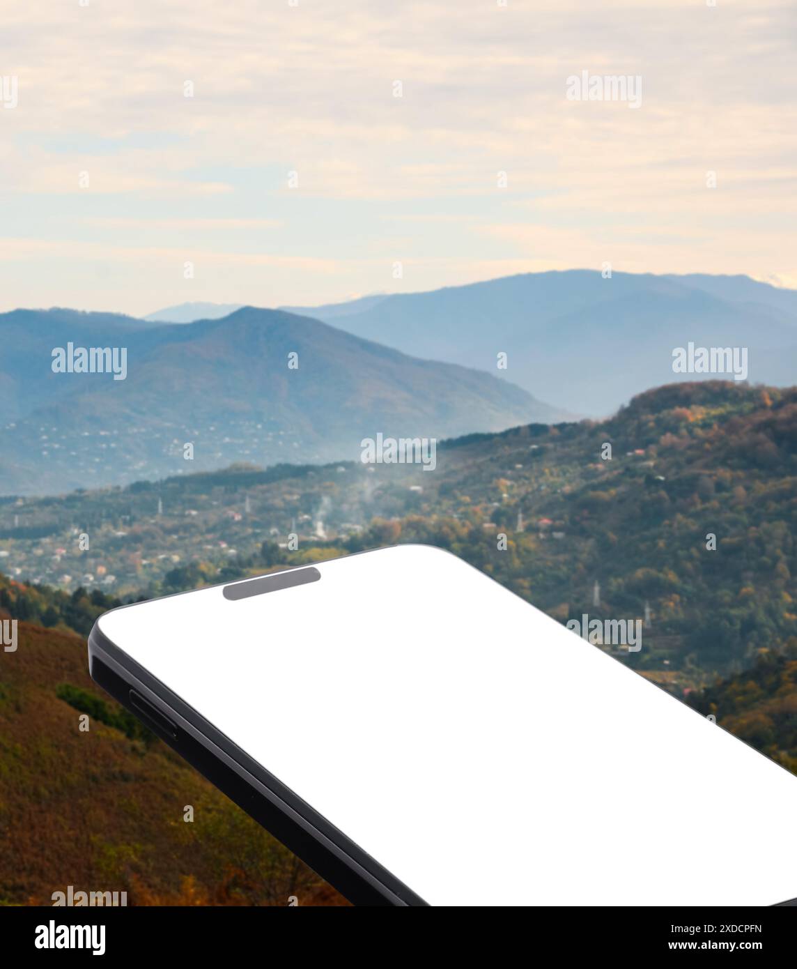 Mobile phone with empty screen and beautiful mountain landscape. Space ...