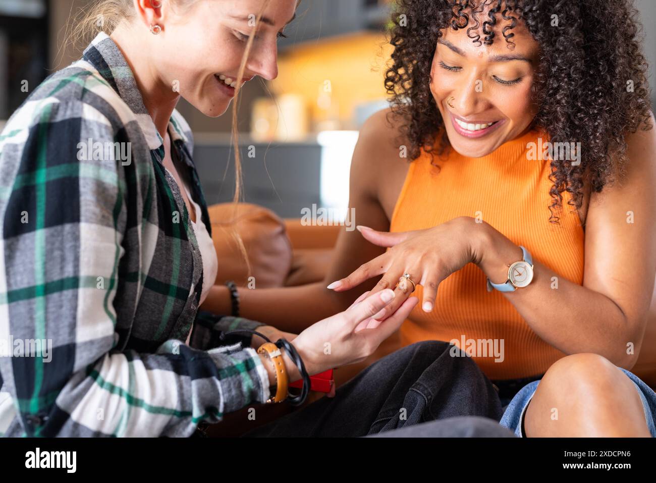 Bride showing engagement ring friends hi-res stock photography and ...