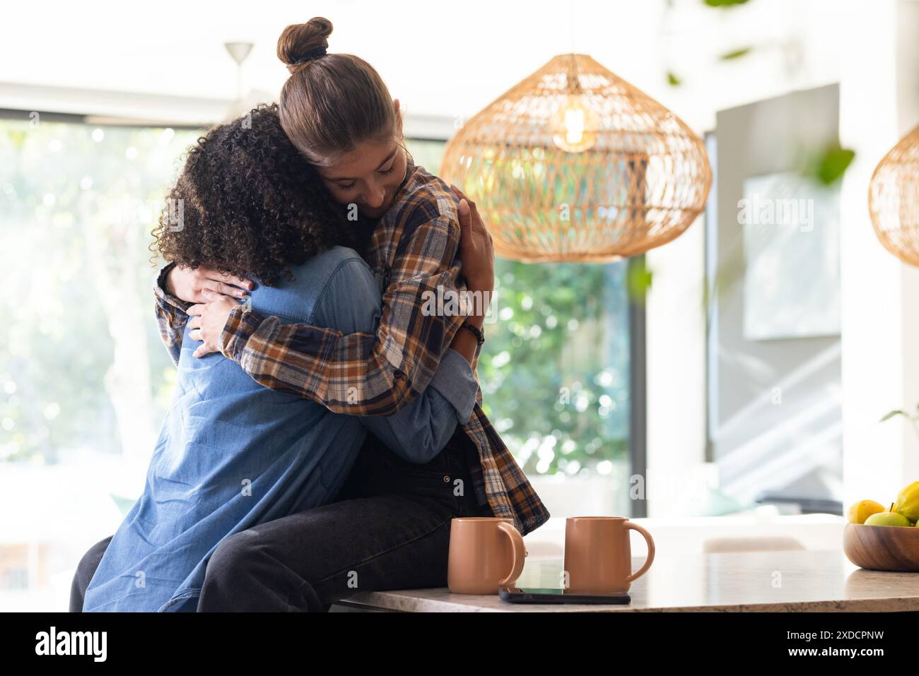 Two people hugging hi-res stock photography and images - Alamy