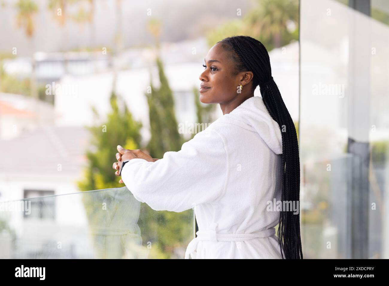 Woman on balcony in white hi-res stock photography and images - Alamy